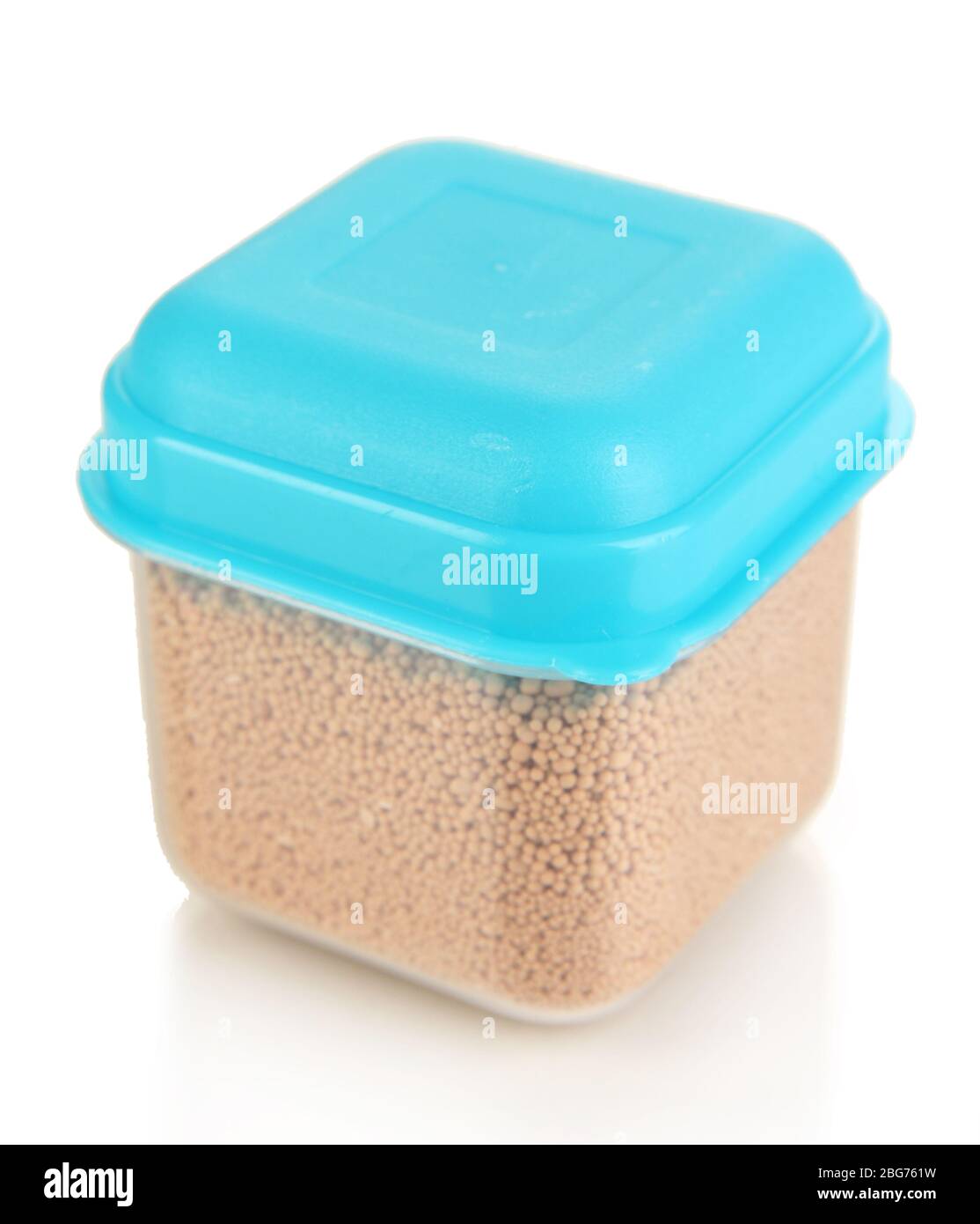 Dry yeast in container isolated on white Stock Photo - Alamy