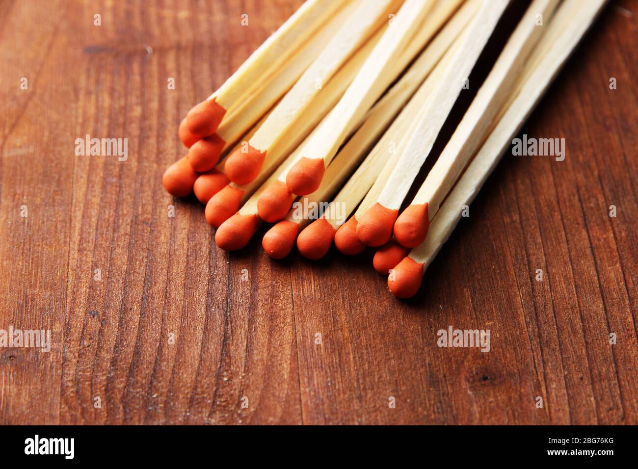Long matches for fireplace, on wooden background Stock Photo - Alamy
