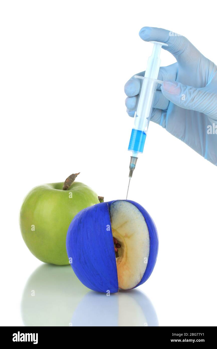 Injection into apple isolated on white Stock Photo - Alamy