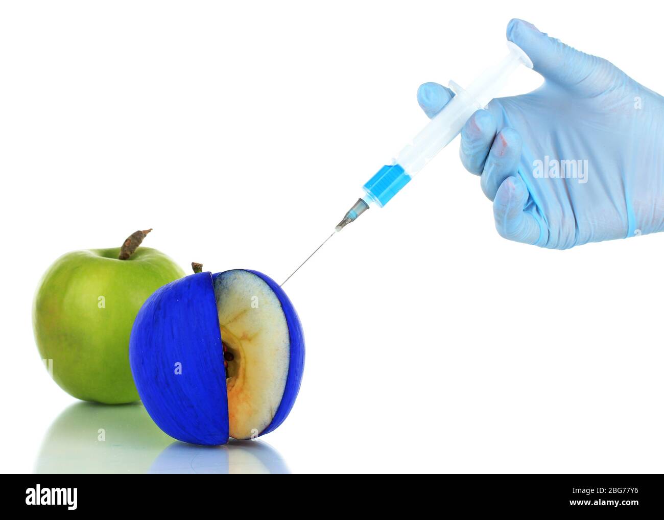 Injection into apple isolated on white Stock Photo - Alamy