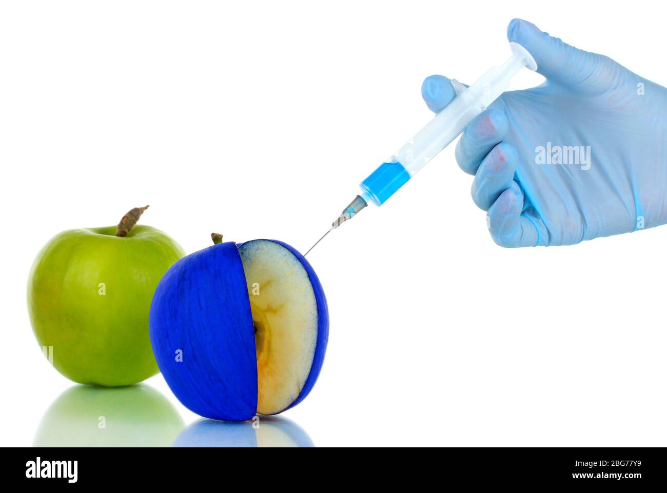 Injection into apple isolated on white Stock Photo - Alamy