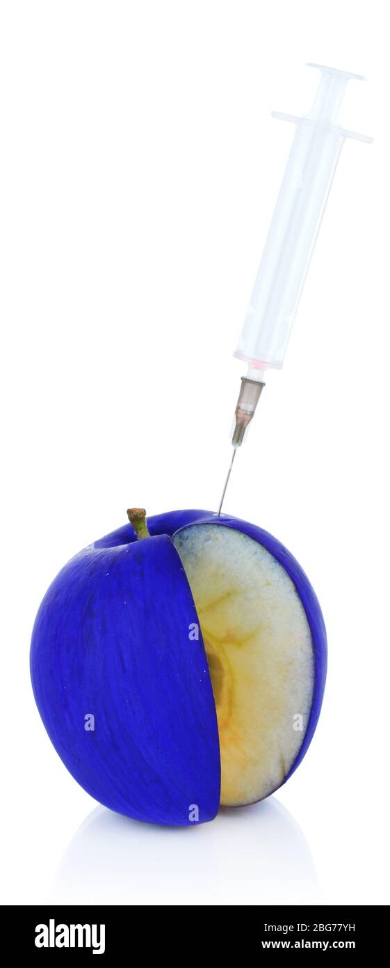 Injection into apple isolated on white Stock Photo - Alamy