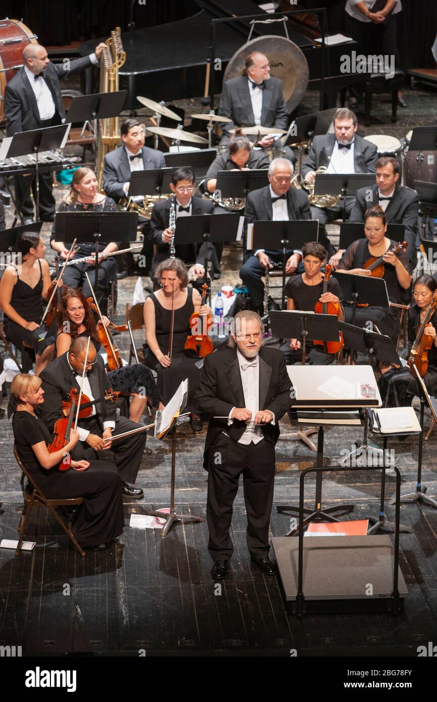 Conductor of classical orchestra (all model released) announces next ...