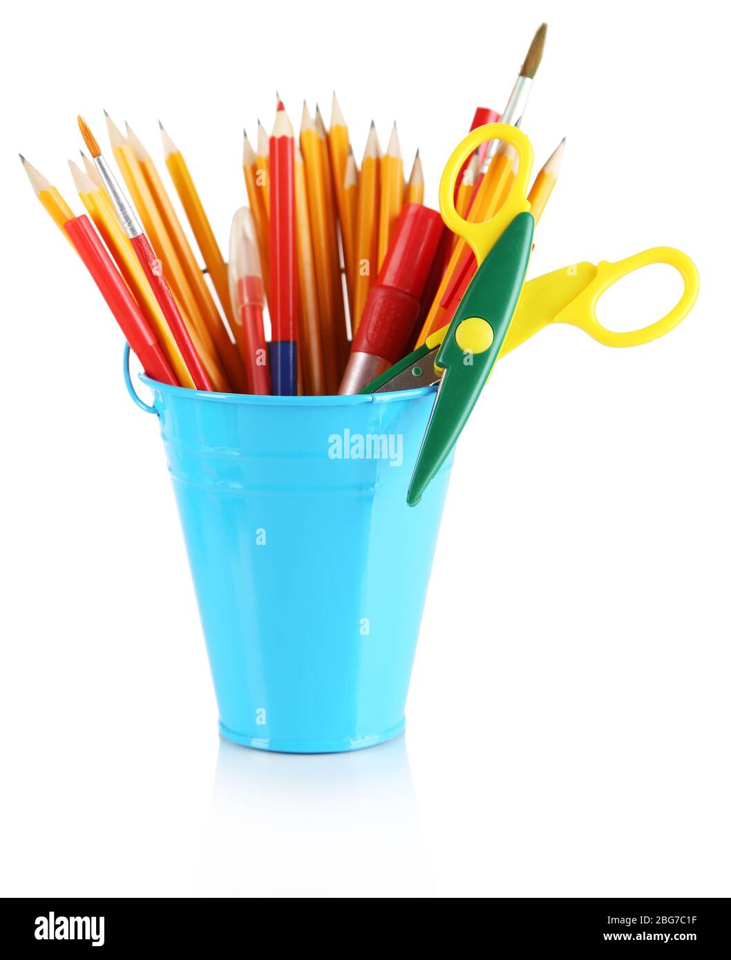 Colorful pencils and other art supplies in pail isolated on white Stock ...