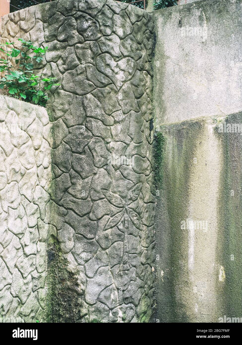 Decorative concrete wall with patterns on the street Stock Photo - Alamy