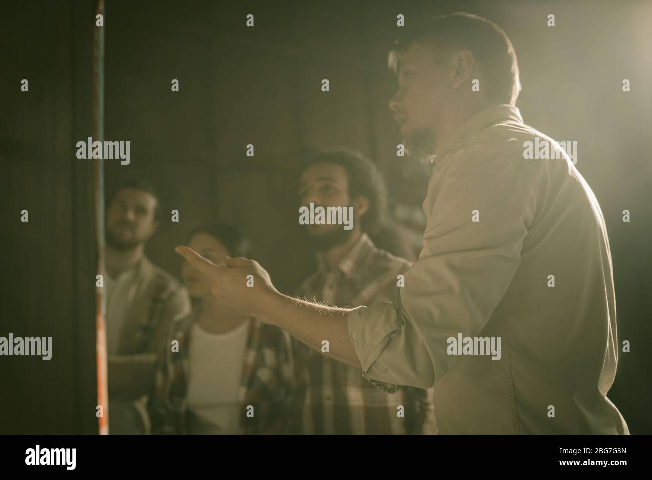 Coworkers Team Looking At Map Hanging On Office Wall Stock Photo - Alamy
