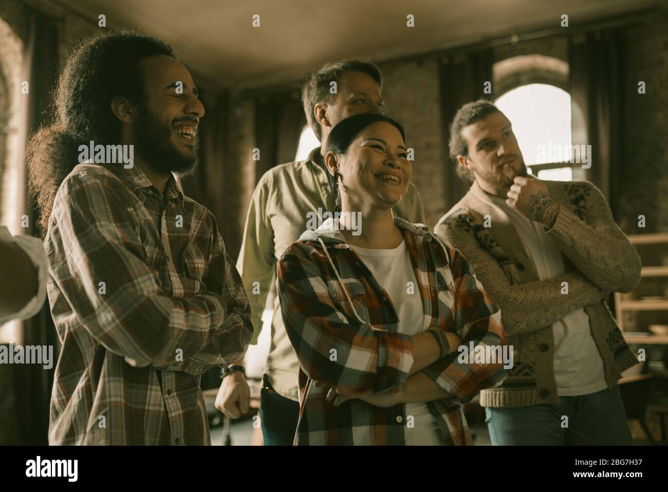 Group laughing work hi-res stock photography and images - Alamy