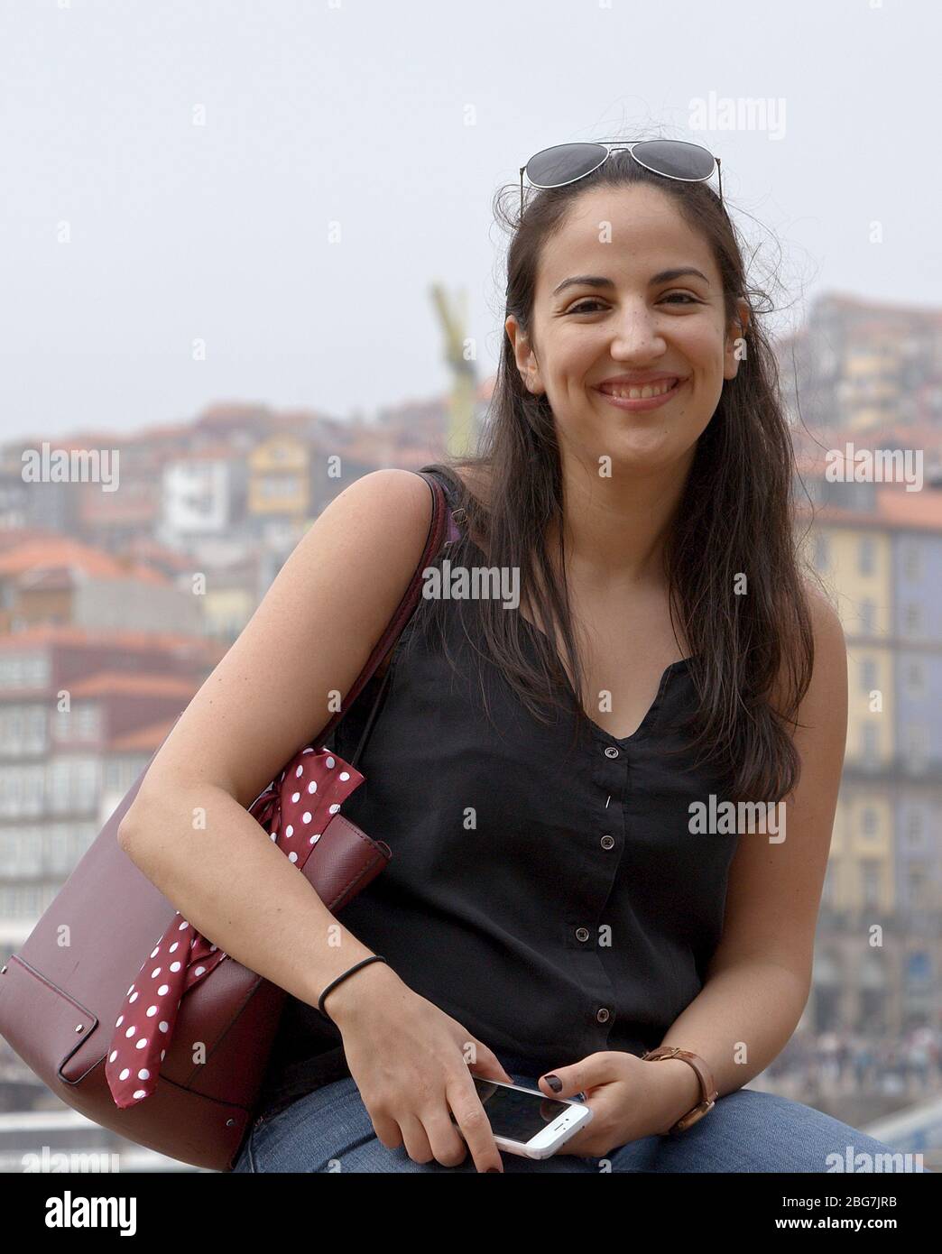 Cute girl in the city of Porto in Portugal Stock Photo - Alamy