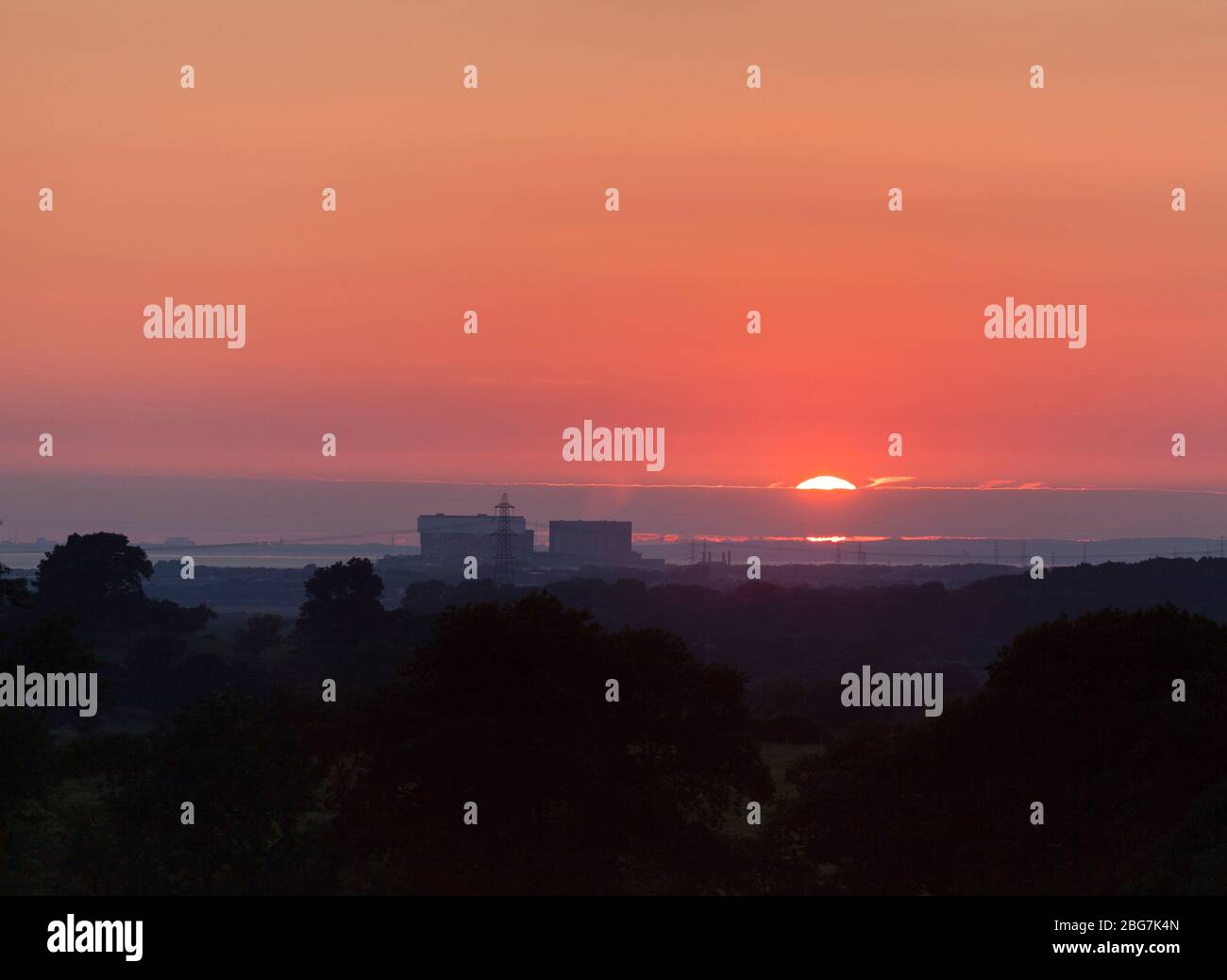 Sunset behind Heysham 1 and Heysham 2 nuclear power station, owned by ...