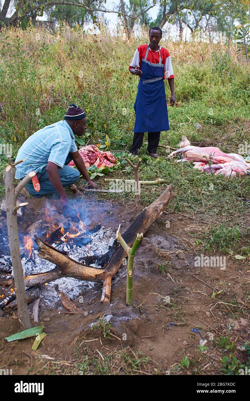 Maasai preparing a goat for a traditional barbecue Stock Photo - Alamy