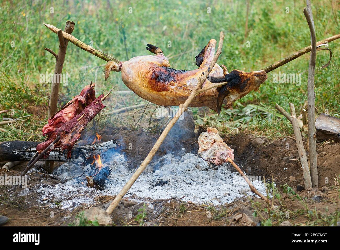 Maasai preparing a goat for a traditional barbecue Stock Photo - Alamy