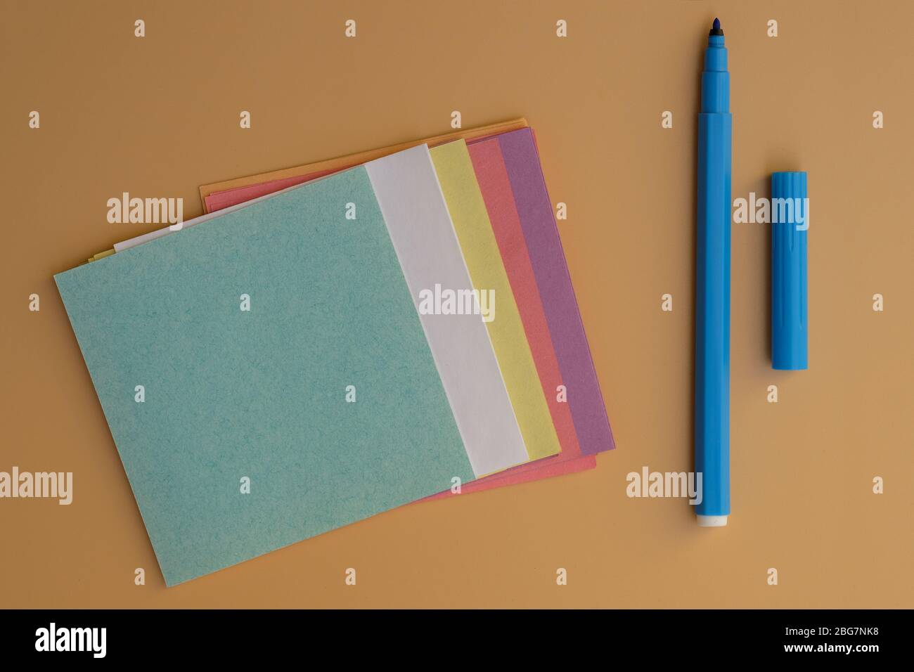 Reminder sticky note on background, empty space for text. Blue felt-tip ...