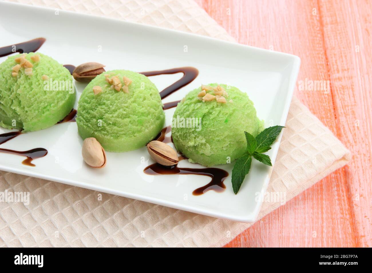 Delicious ice cream on plate on table close-up Stock Photo - Alamy