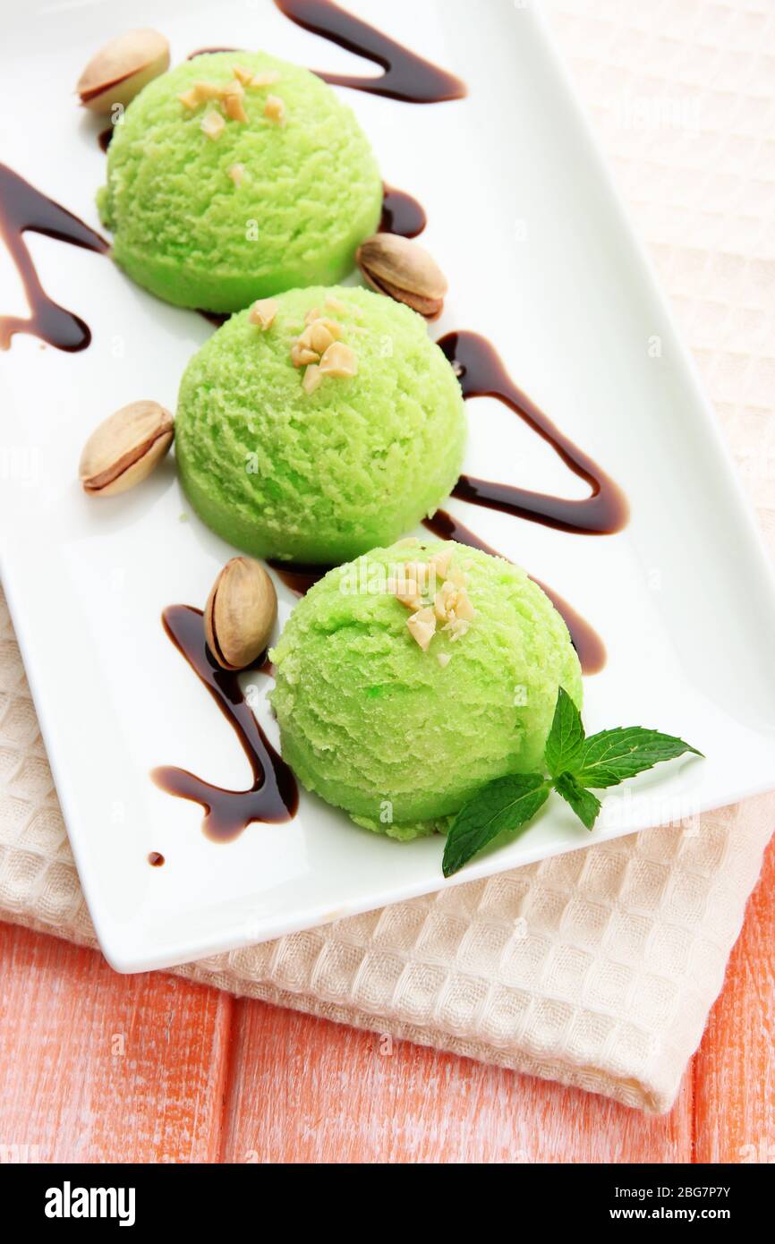 Delicious ice cream on plate on table close-up Stock Photo - Alamy