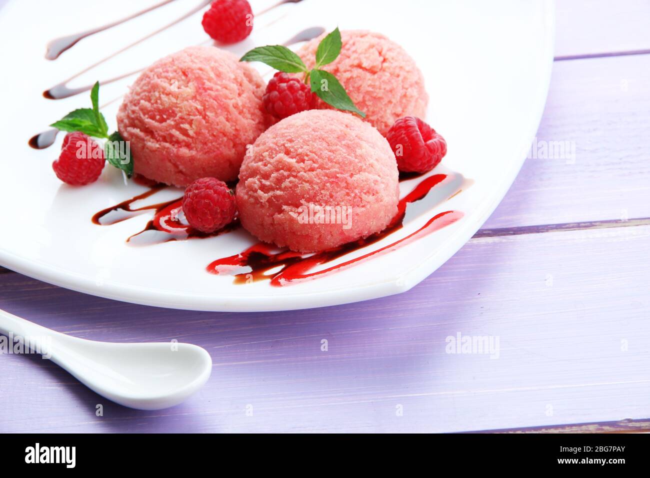 Delicious ice cream on plate on table close-up Stock Photo - Alamy