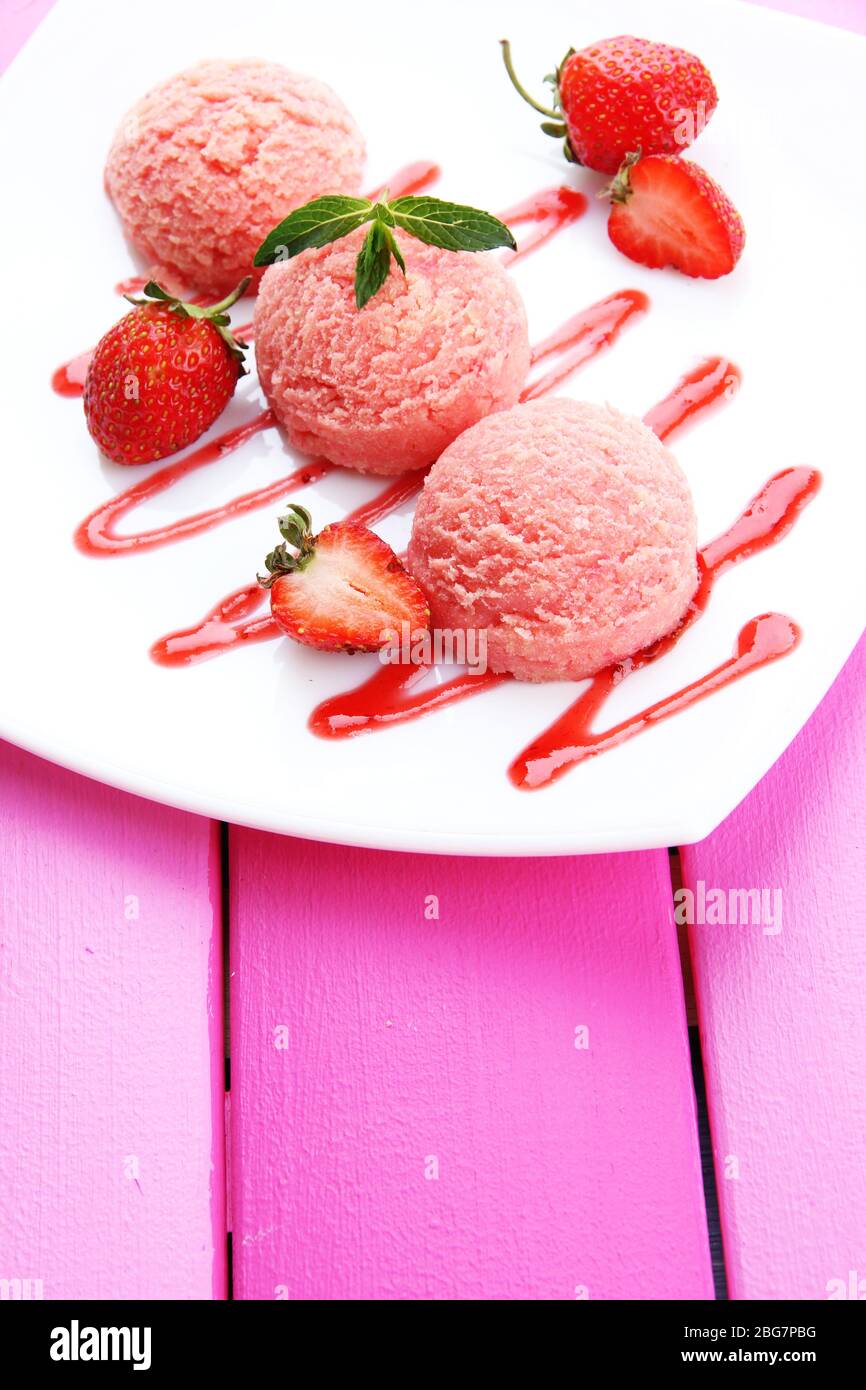 Delicious ice cream on plate on table close-up Stock Photo - Alamy