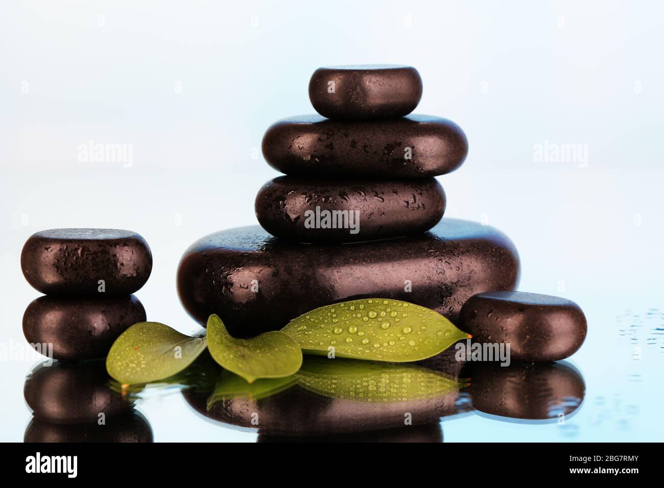 Spa stones on bright background Stock Photo - Alamy