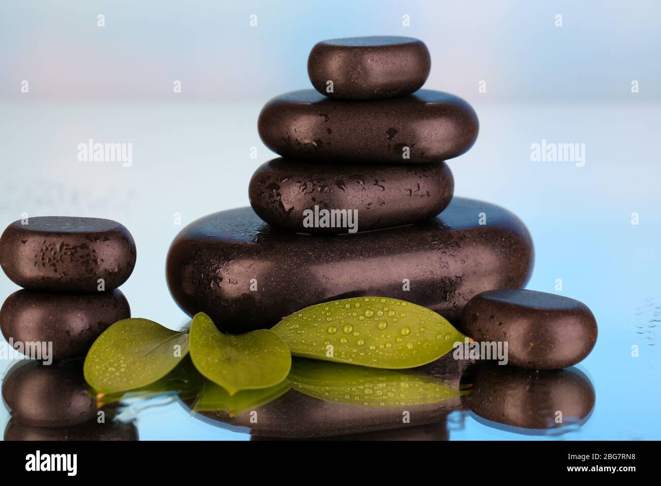 Spa stones on bright background Stock Photo - Alamy