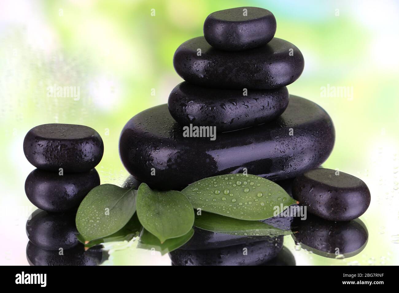 Spa stones on natural background Stock Photo - Alamy