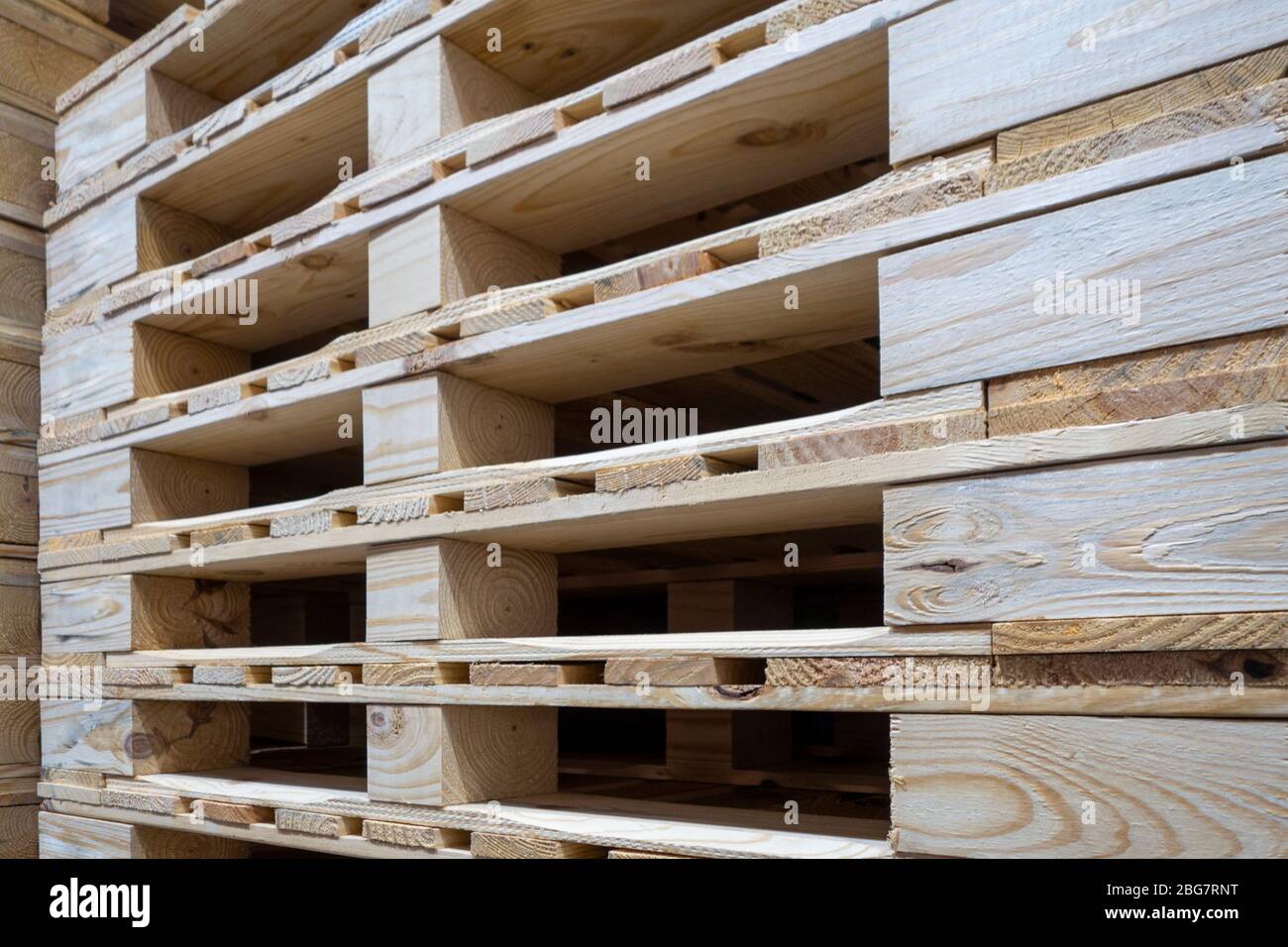 fork lift shipping pallets stacked and ready to be used at a warehouse ...