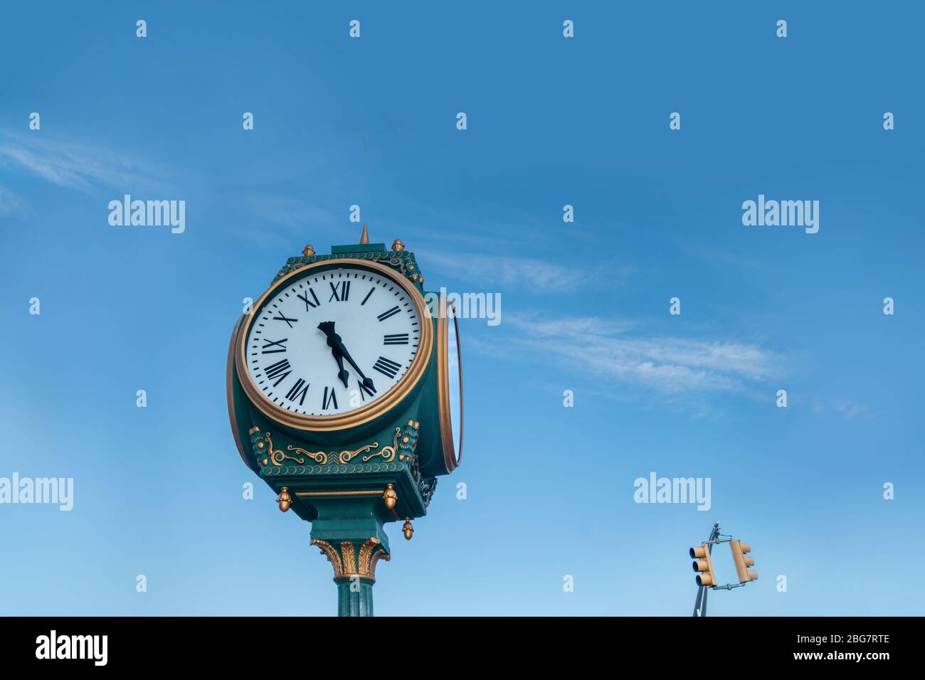 blue sky with big clock and street lights with light clouds Stock Photo ...