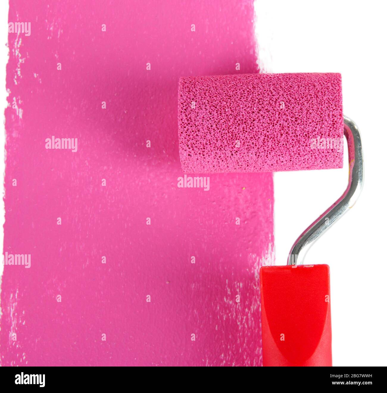 Roller brush with pink paint Stock Photo - Alamy