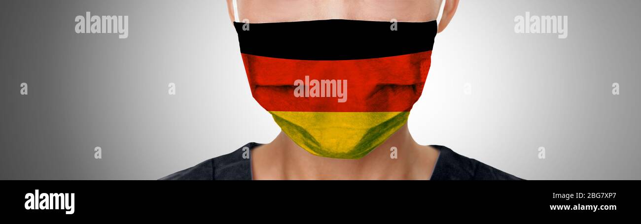 German COVID-19 masks flag on PPE doctor wearing mask panoramic banner ...