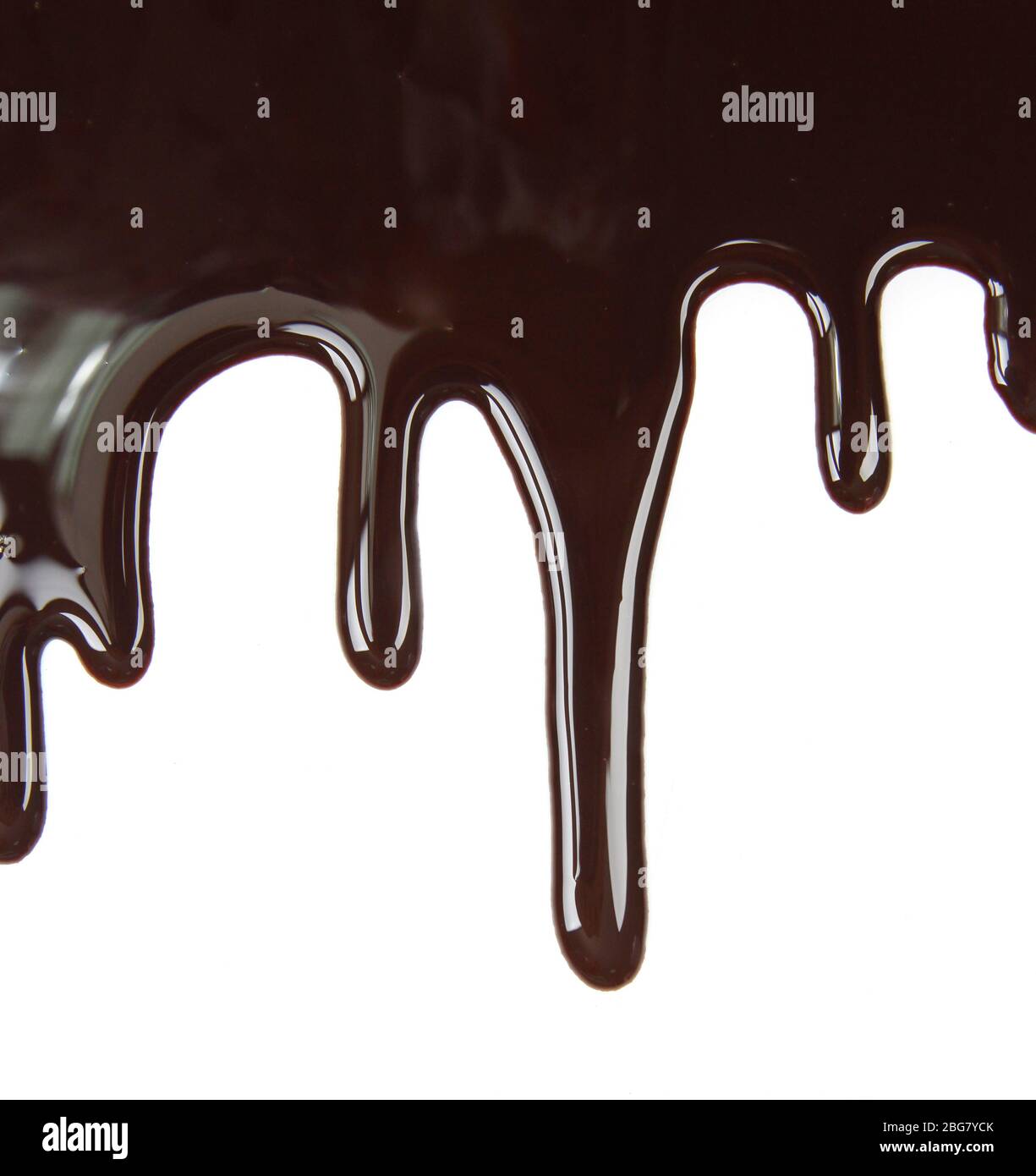 Melted chocolate dripping on white background Stock Photo - Alamy