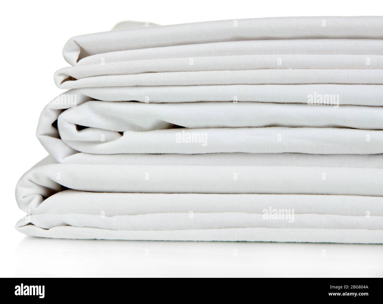 Stack of clean bedding sheets isolated on white Stock Photo - Alamy