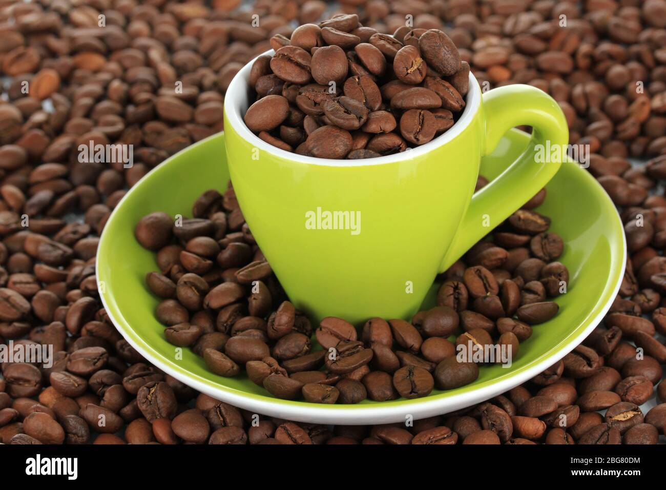 Coffee beans in cup close-up Stock Photo - Alamy