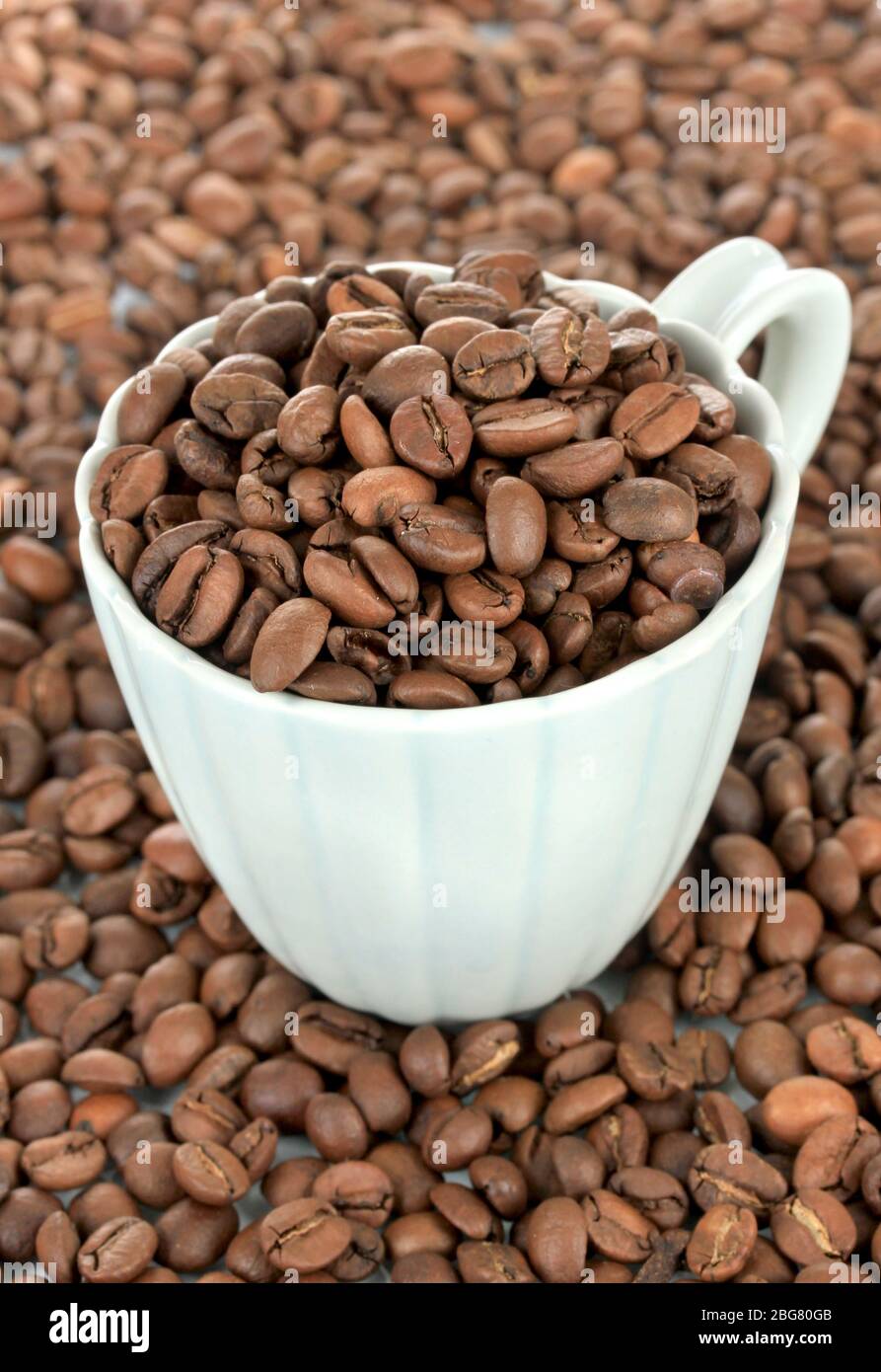 Coffee beans in cup close-up Stock Photo - Alamy