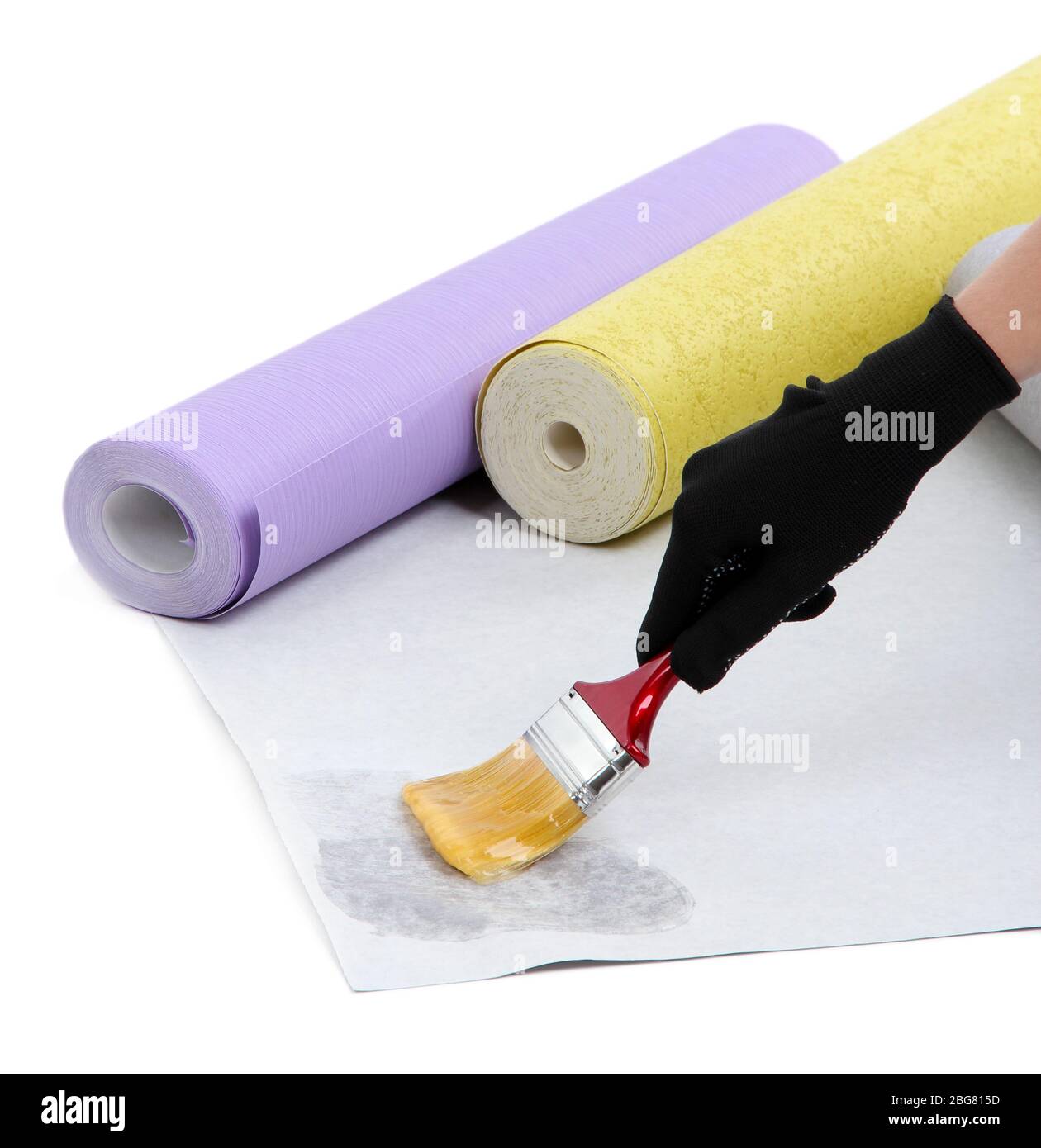 Hand smearing wallpaper by glue, isolated on white Stock Photo - Alamy