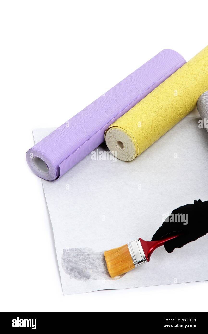 Hand smearing wallpaper by glue, isolated on white Stock Photo - Alamy
