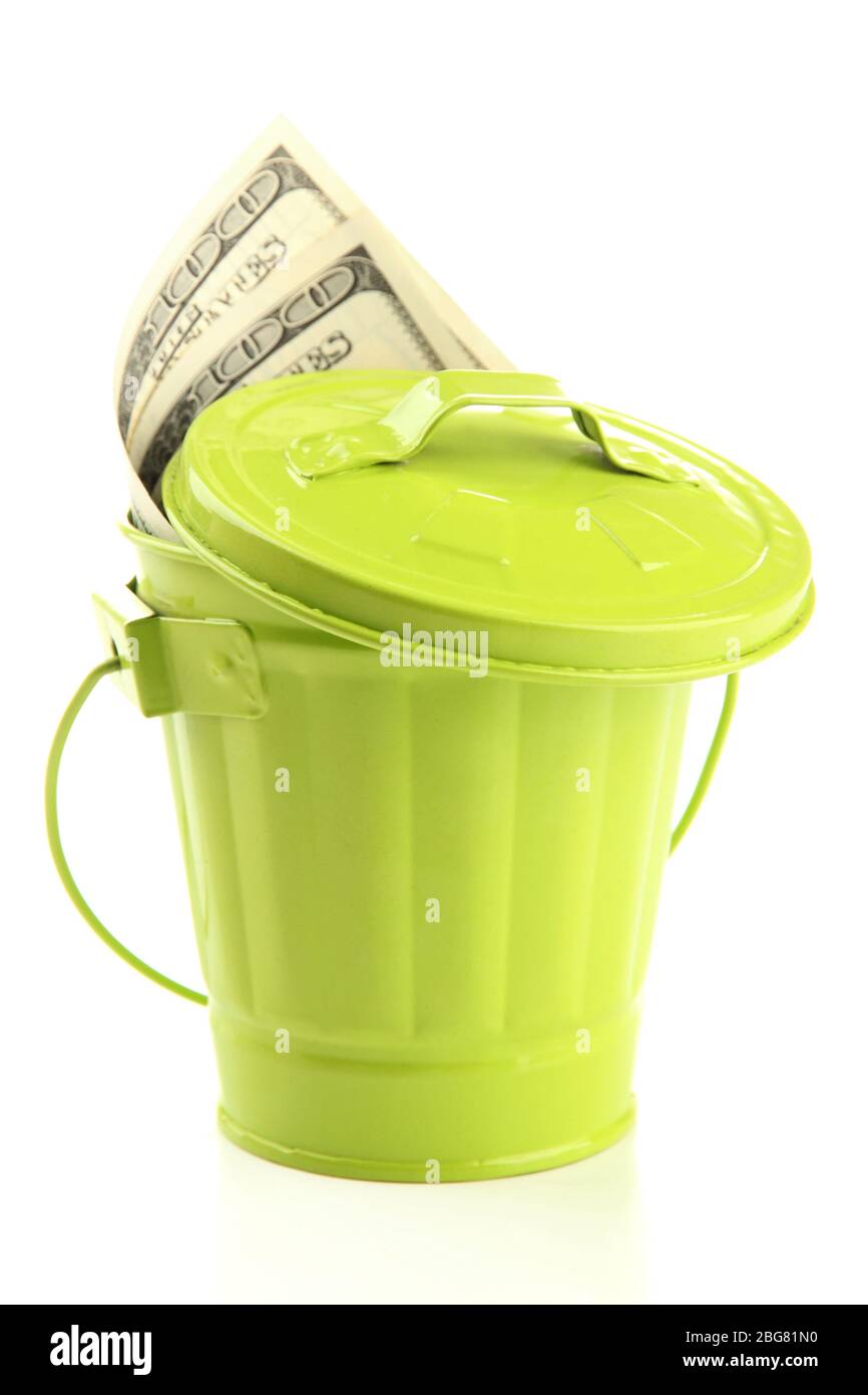 Money in trash can, isolated on white Stock Photo - Alamy