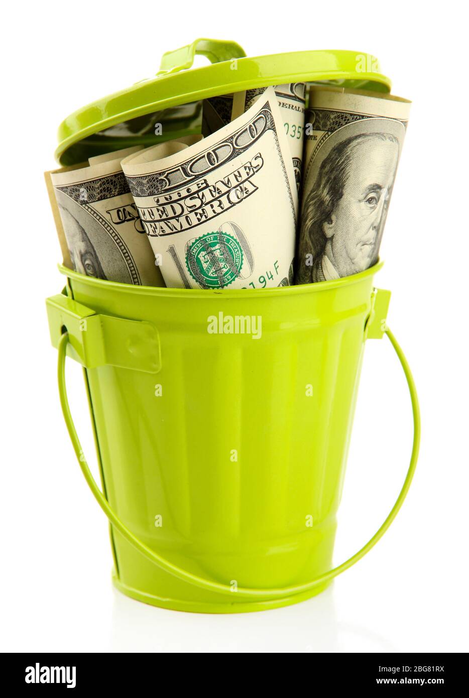 Money in trash can, isolated on white Stock Photo - Alamy