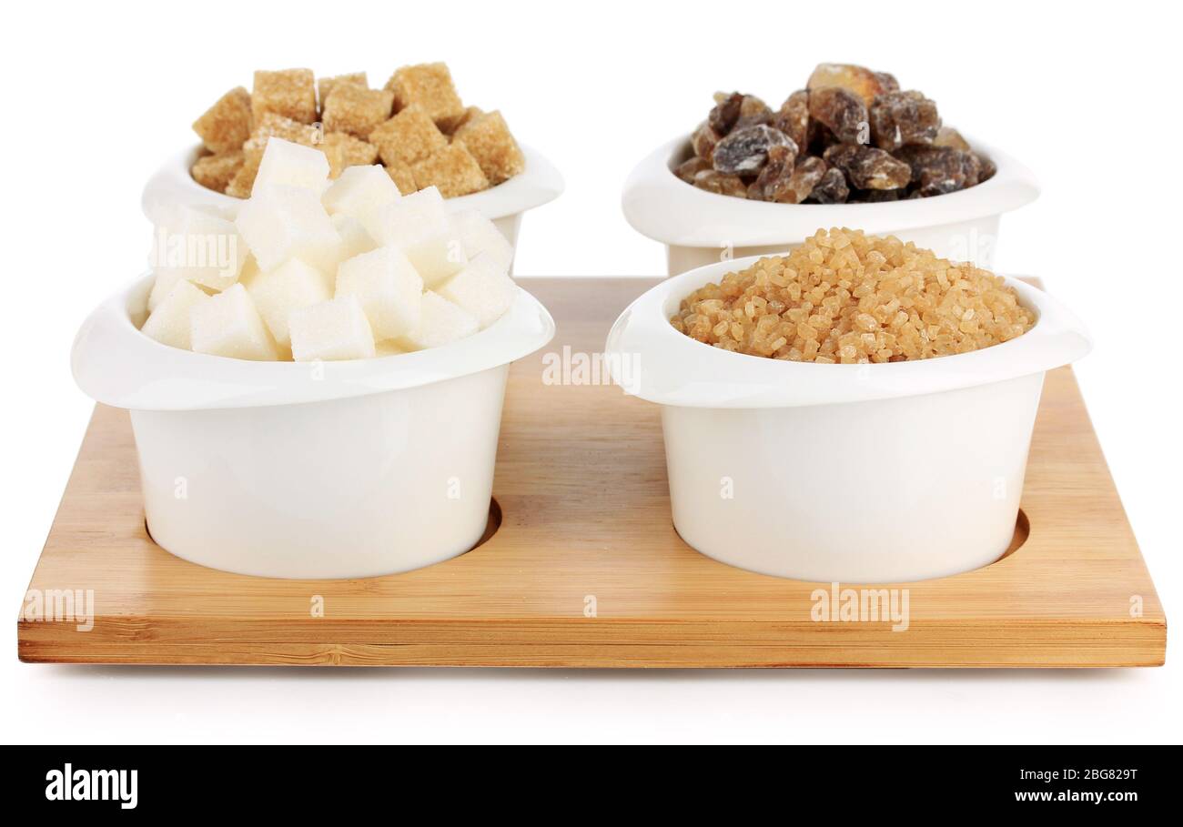 Different types of sugar in bowls isolated on white Stock Photo - Alamy