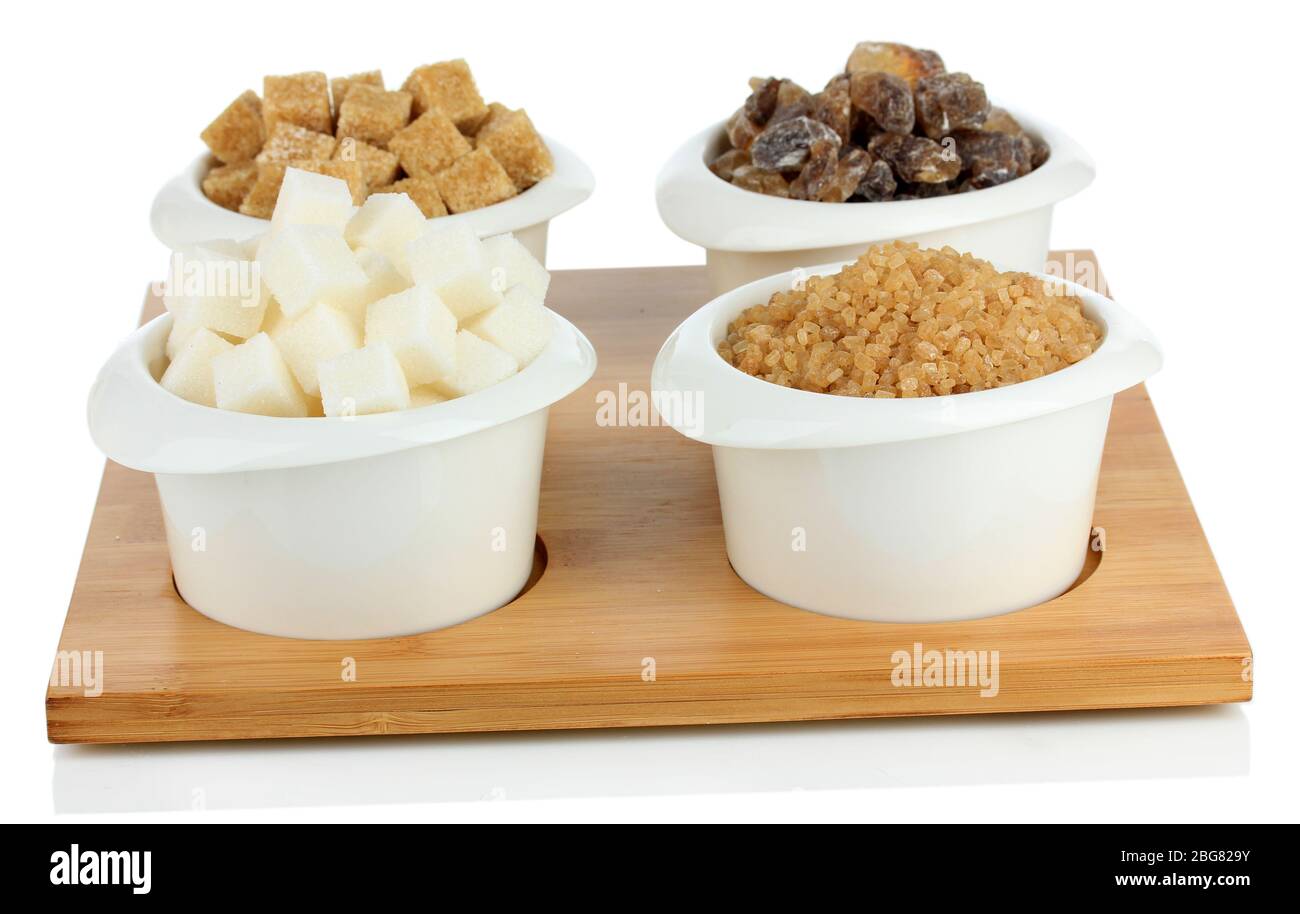Different types of sugar in bowls isolated on white Stock Photo - Alamy