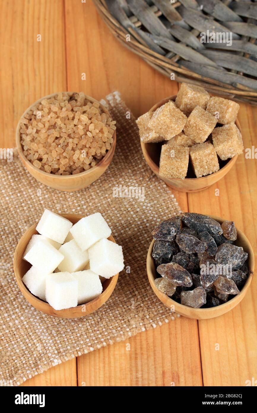 Different types of sugar in bowls on table close-up Stock Photo - Alamy