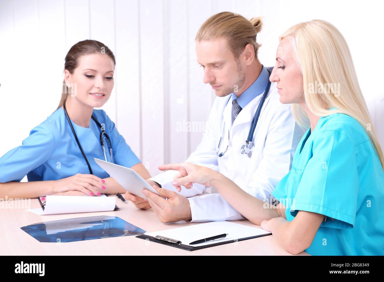 Medical team during meeting in office Stock Photo - Alamy