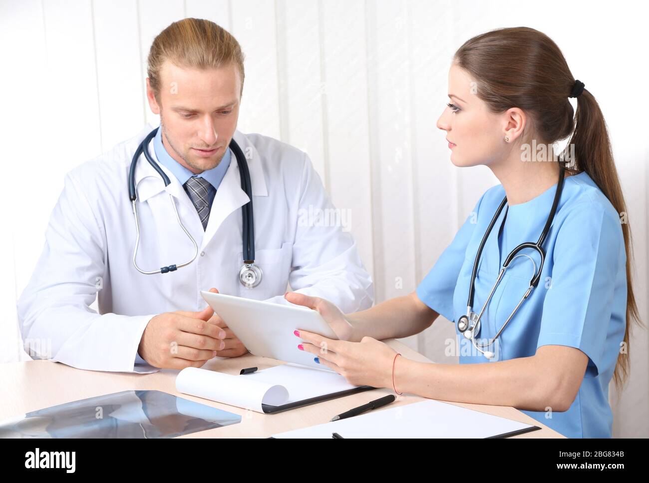 Medical team during meeting in office Stock Photo - Alamy