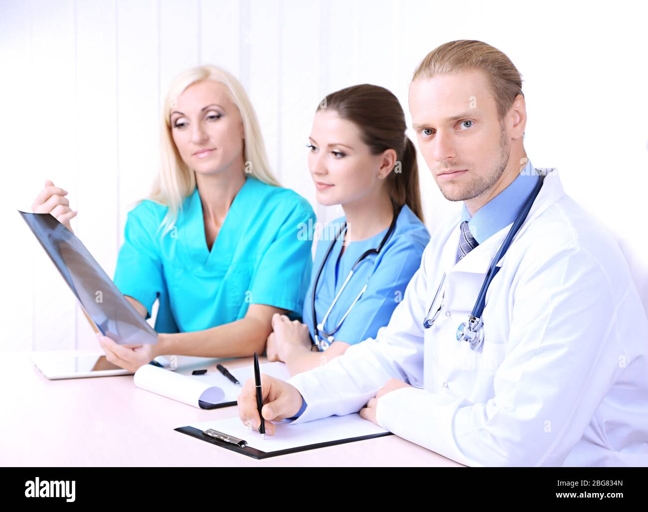 Medical team during meeting in office Stock Photo - Alamy