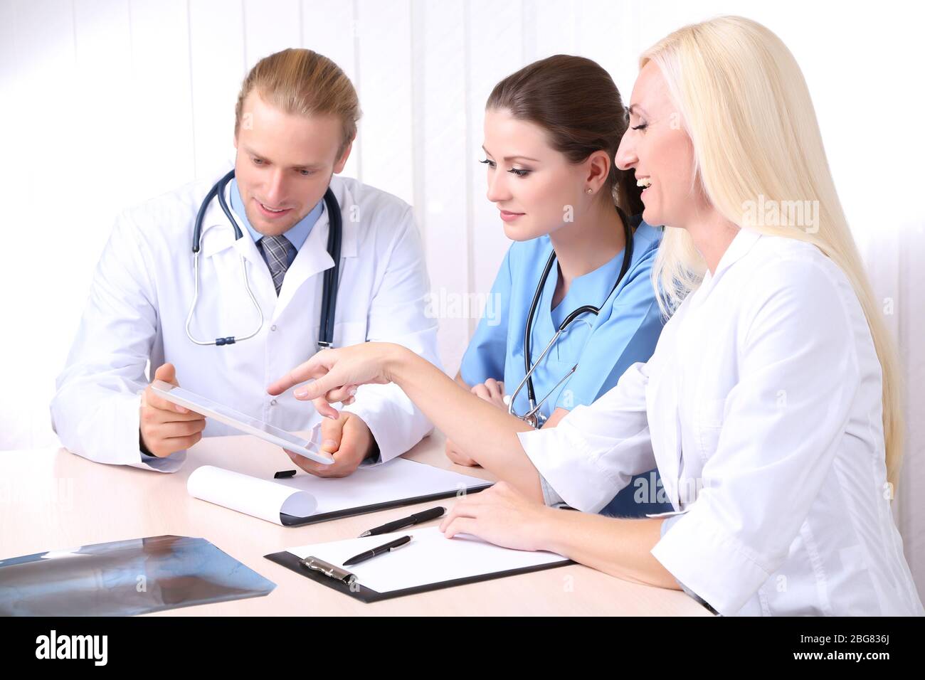 Medical team during meeting in office Stock Photo - Alamy