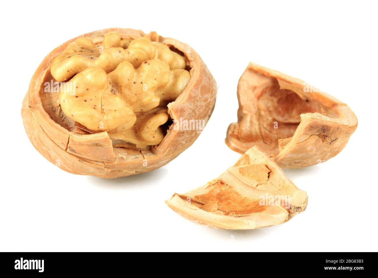 Broken walnut isolated on white Stock Photo - Alamy
