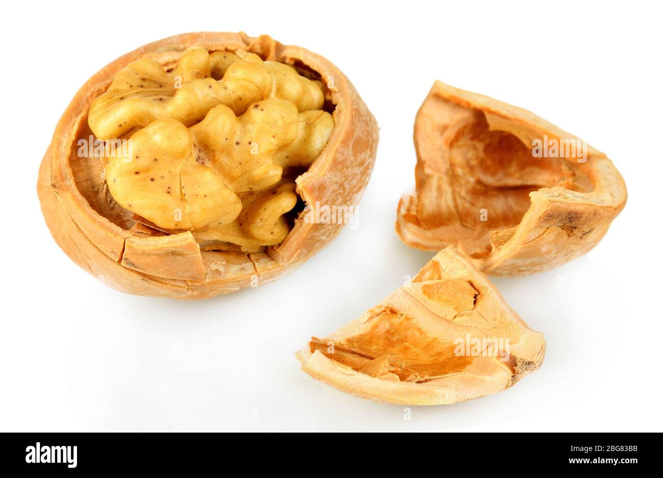 Broken walnut isolated on white Stock Photo - Alamy