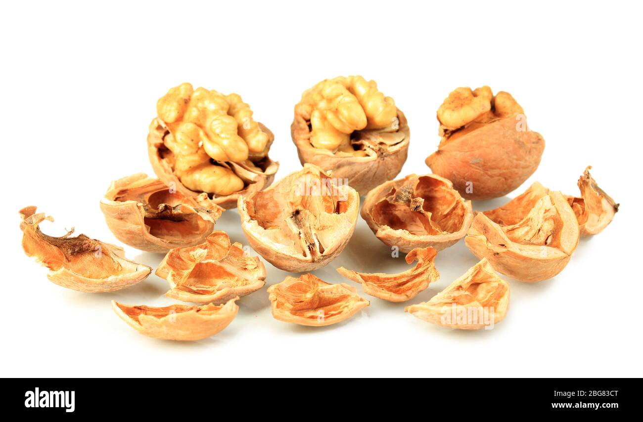 Broken walnuts isolated on white Stock Photo - Alamy