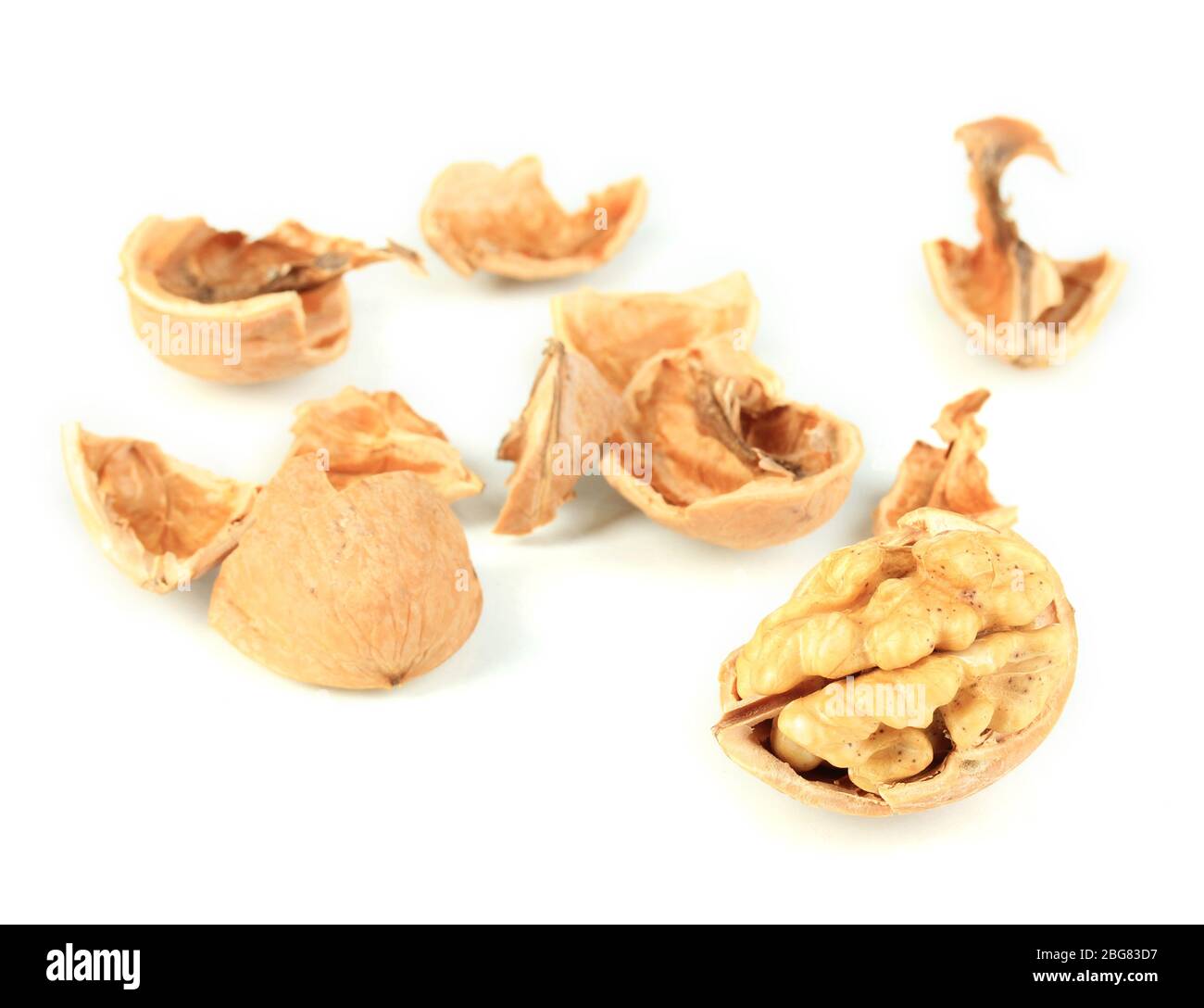 Broken walnut isolated on white Stock Photo - Alamy