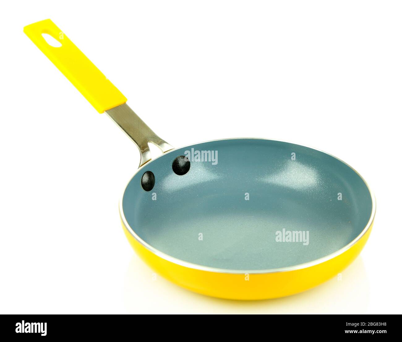 Little yellow pan isolated on white Stock Photo - Alamy