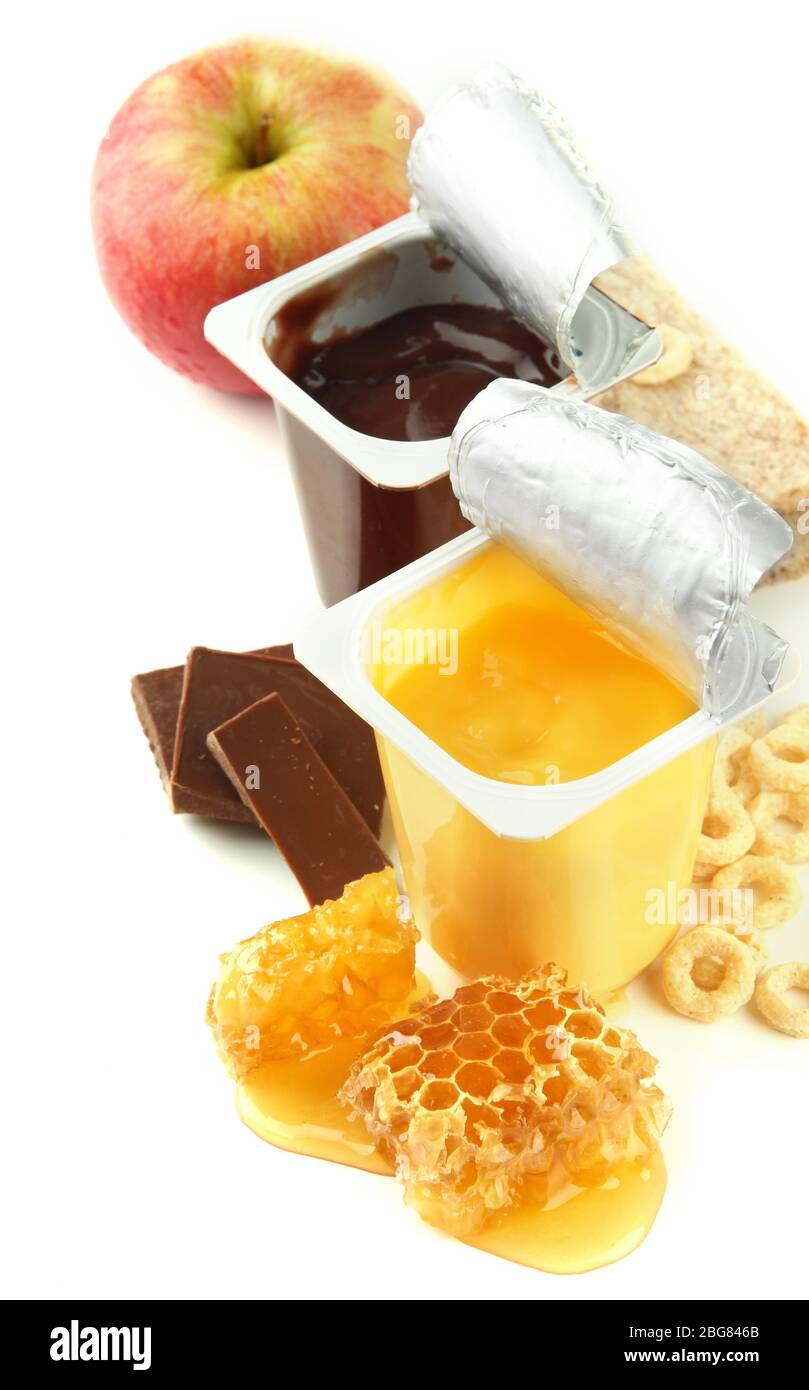 Tasty dessert in open plastic cup and honey combs, fruit, isolated on ...