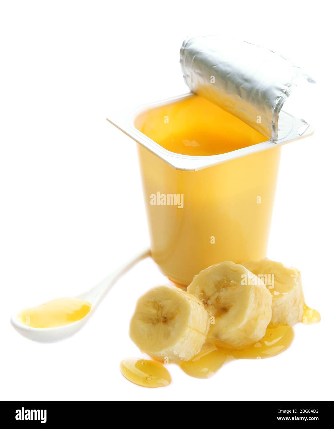 Tasty dessert in open plastic cup and banana, isolated on white Stock ...