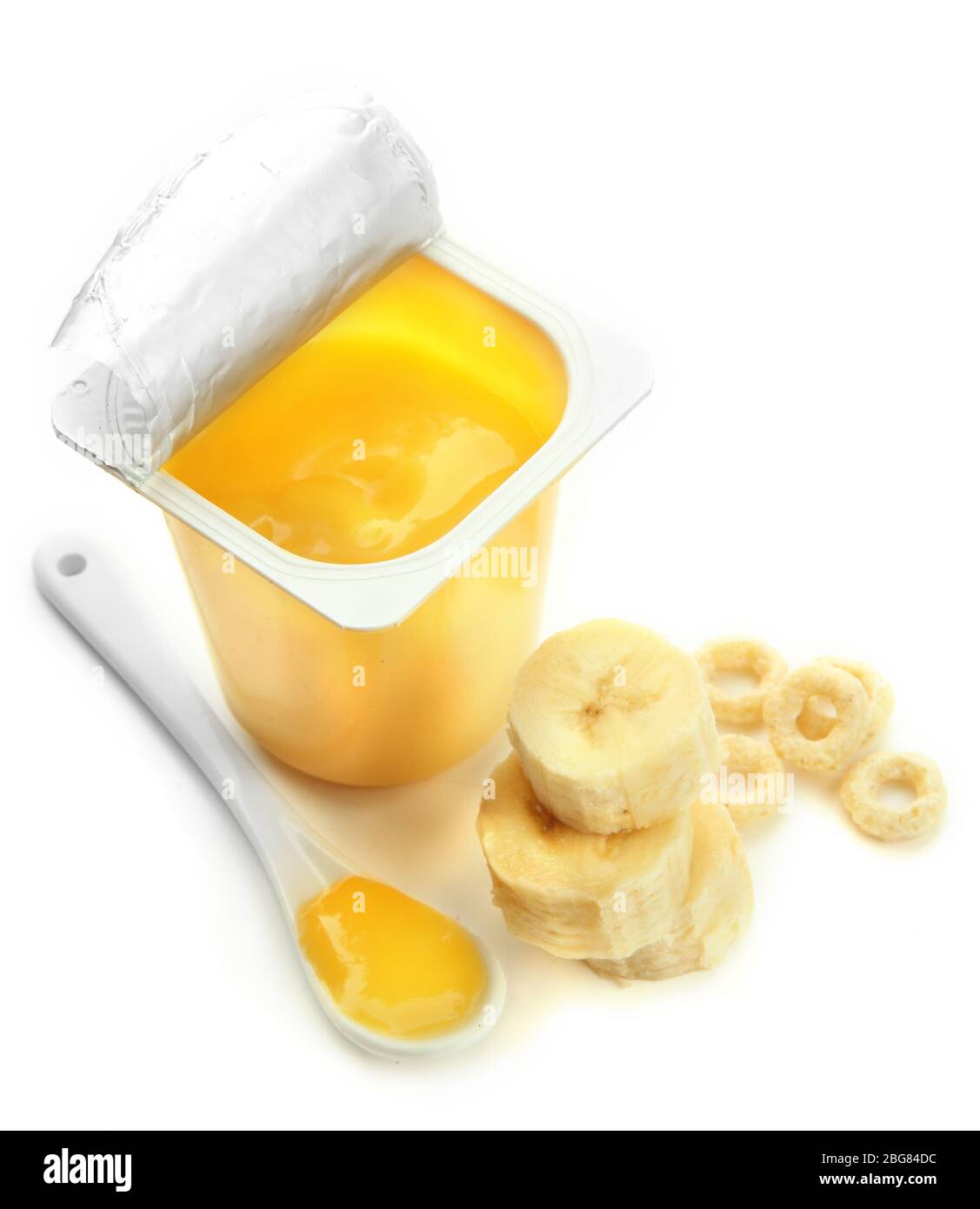 Tasty dessert in open plastic cup and banana, isolated on white Stock ...